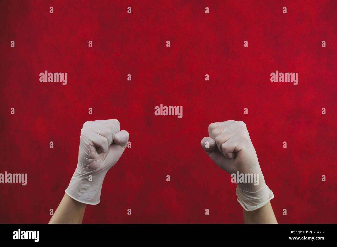 Hands wearing surgical rubber gloves hi-res stock photography and ...