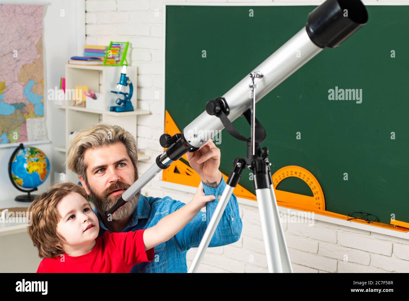 Pupil watching stars with a teacher. Astronomy telescope. Happy cute ...