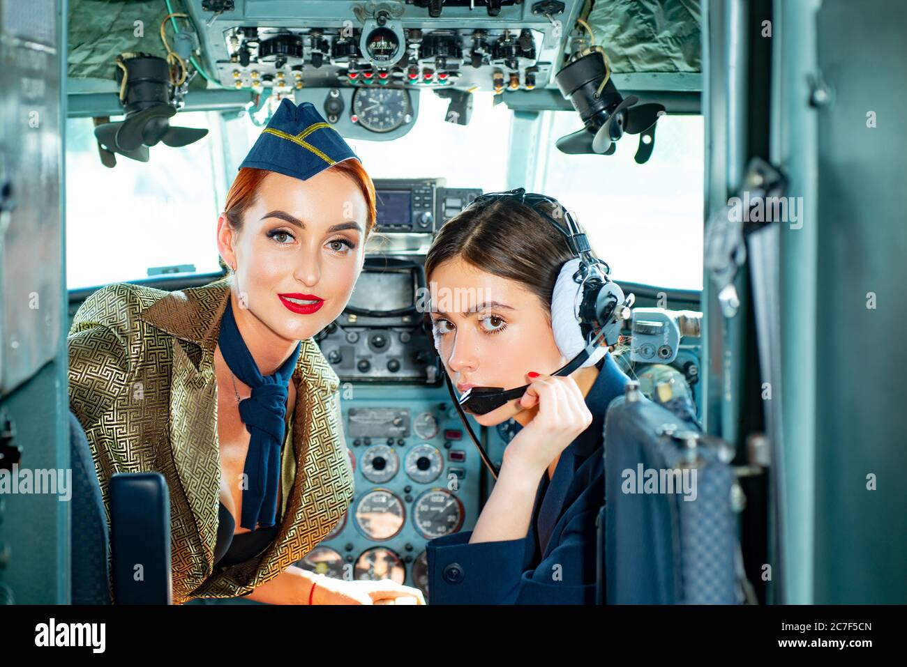 Trainee Pilot and Flight Instructor in an Aircraft Cockpit. Wishes a ...