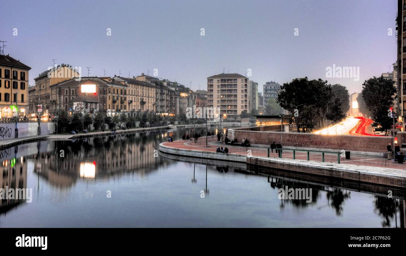 Horizontal shot of a lake with reflection of surrounding trees and high ...
