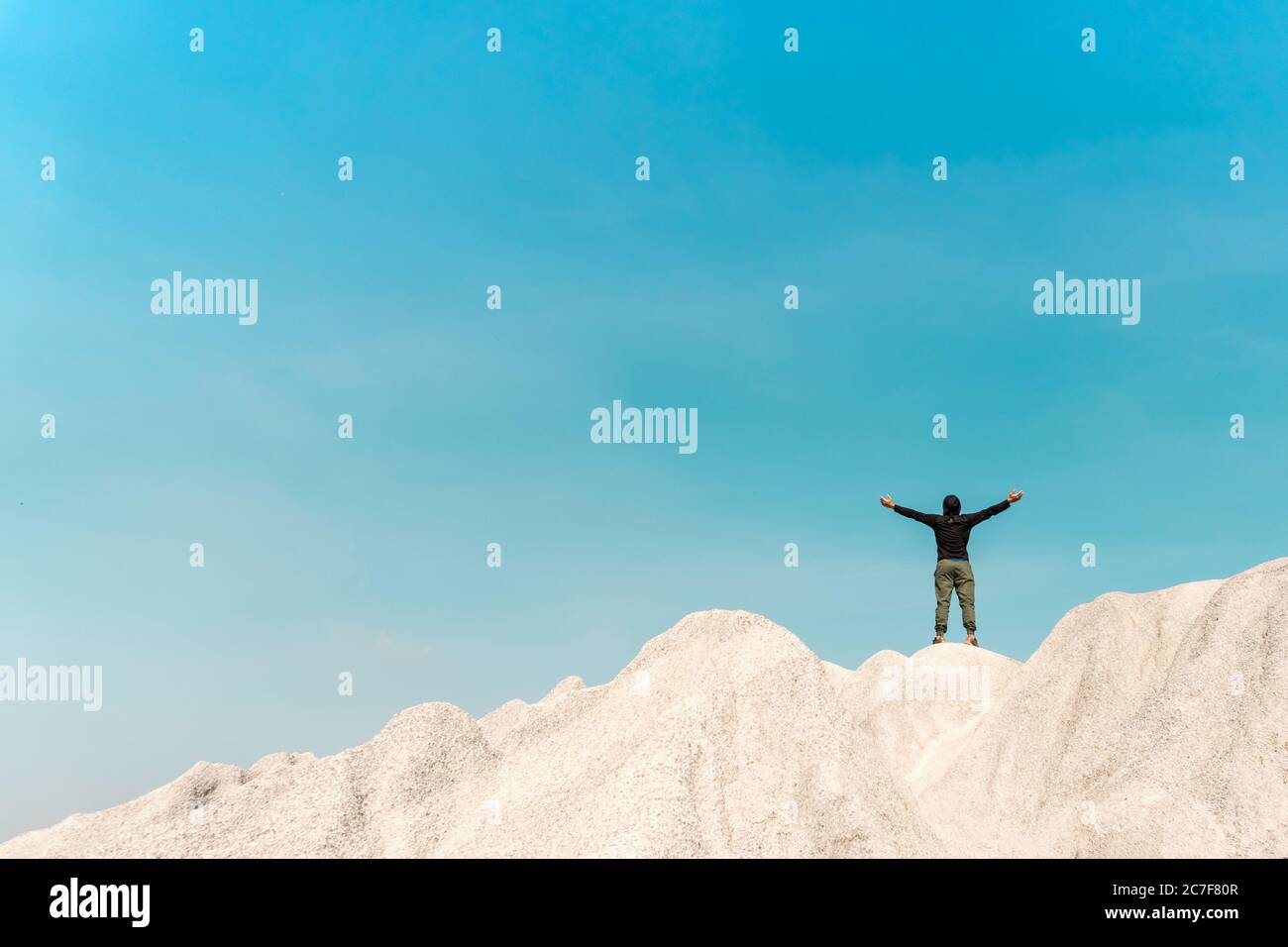 Man rise hands up to sky freedom concept with copyspace blue sky ...