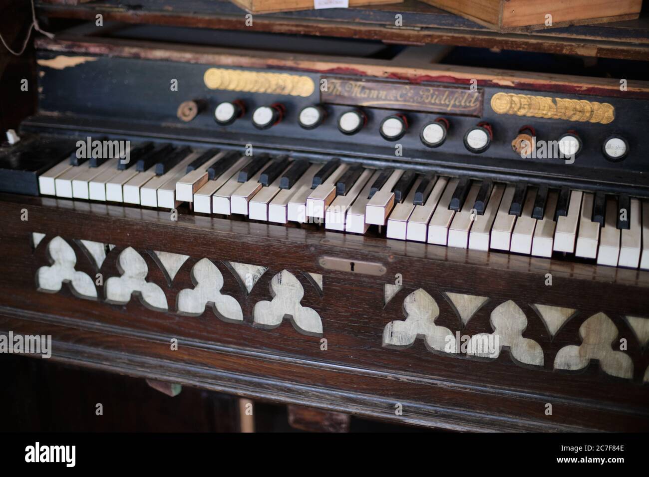 Beautiful and vintage piano with beautiful hand curved patterns on its ...
