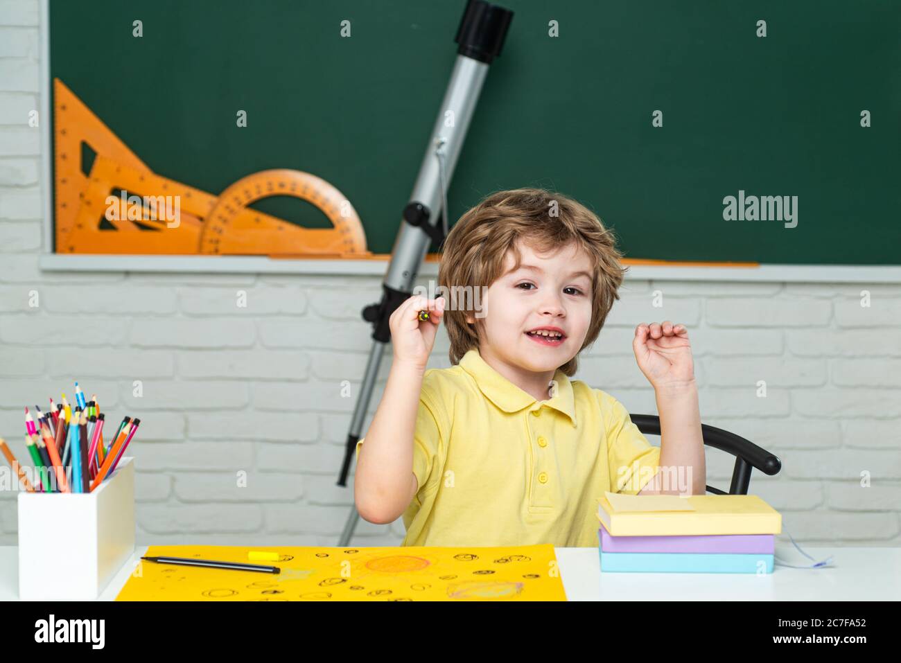 After school teaching. Happy school kids at lesson. Child tutoring ...