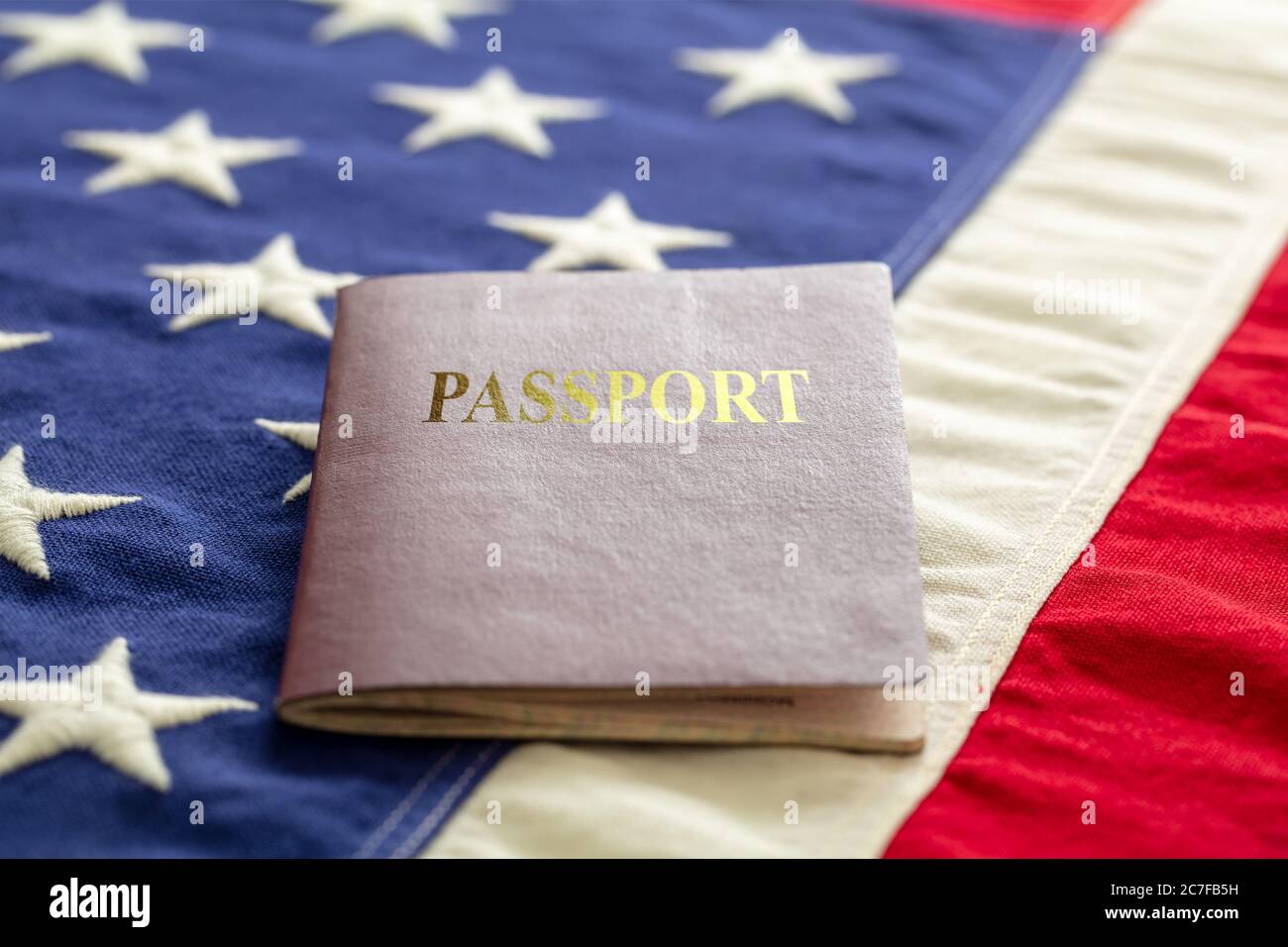 Passport on USA flag background, closeup view. Immigration, United ...