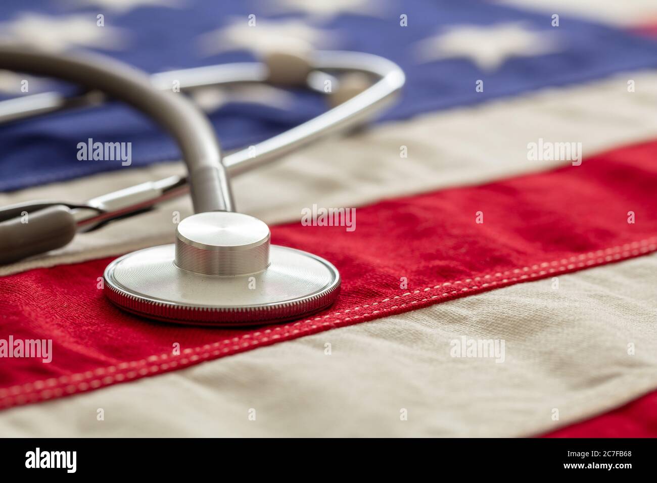 USA health care. Medical stethoscope on a US of America flag, closeup ...