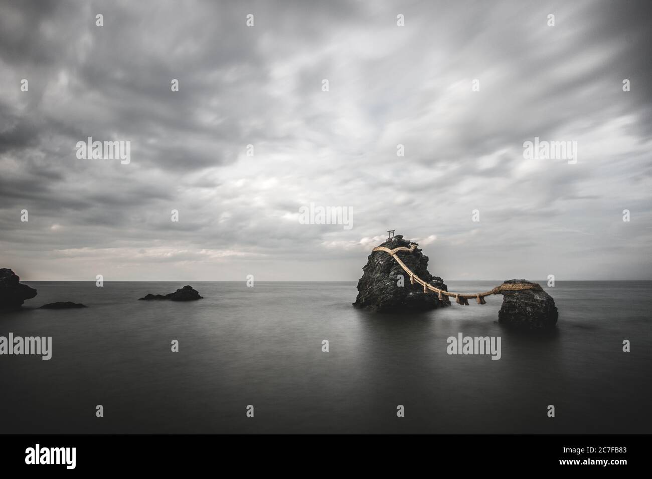 Gloomy scenery of holy rocks in the middle of the ocean in Mie ...