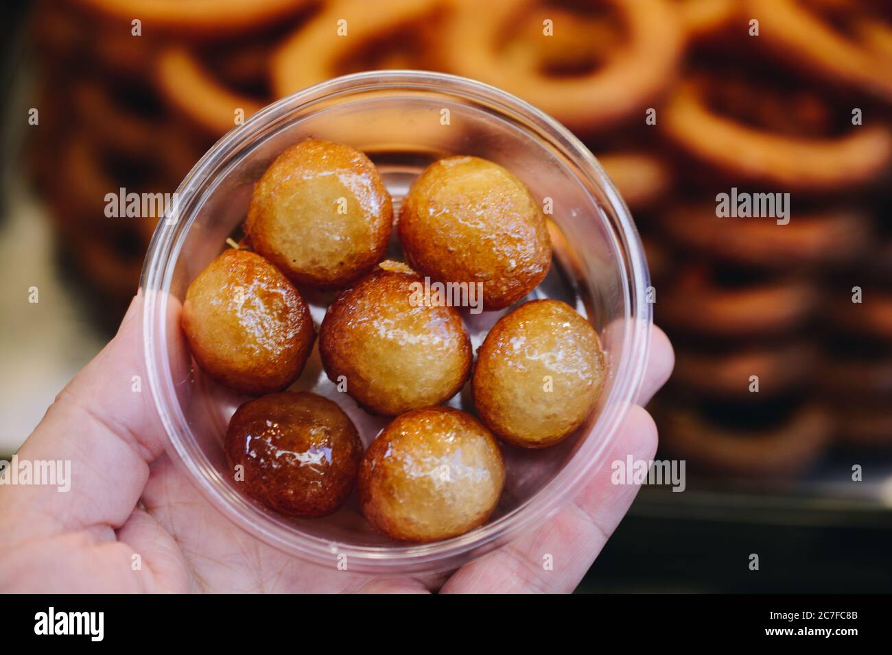 "Lokma" dessert; Traditional Turkish Lokma dessert fryied in oil and ...