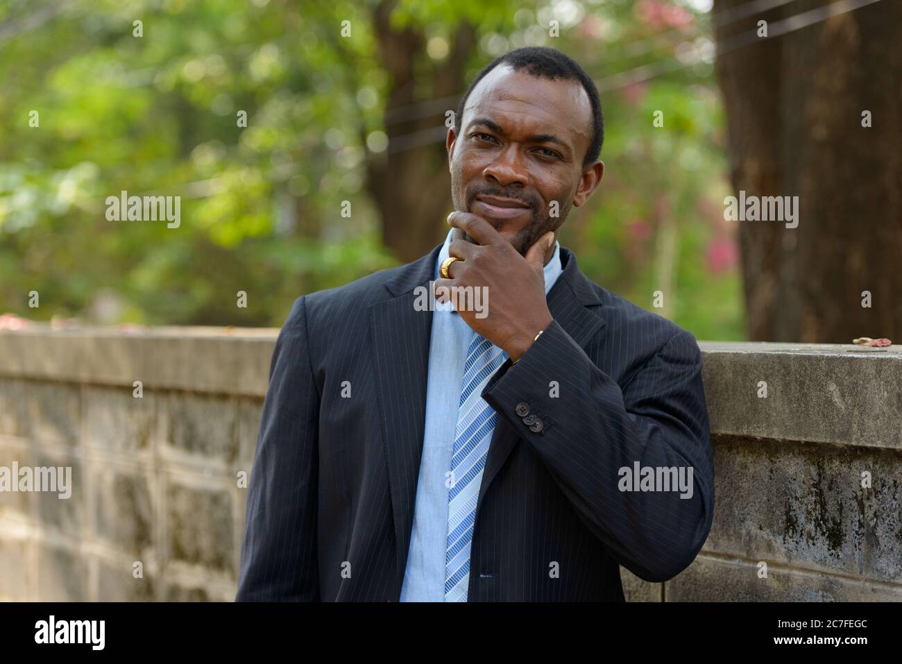 Portrait of handsome bearded African businessman outdoors Stock Photo ...