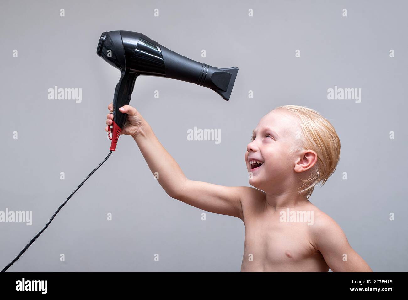 Boy long blond hair blowing hi-res stock photography and images - Alamy