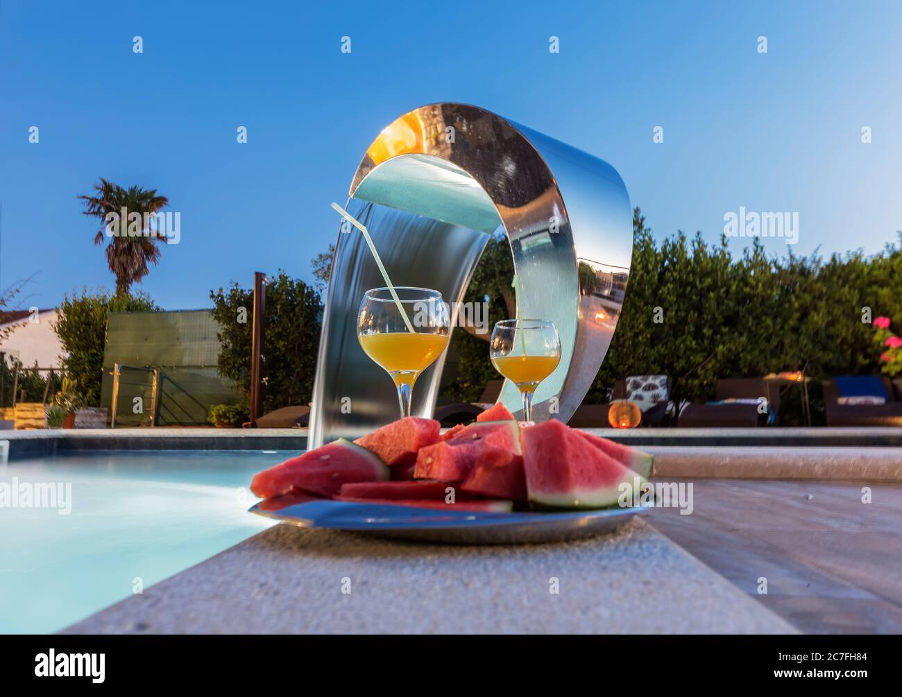 juice and watermelon at outdoor swimming pool Stock Photo - Alamy