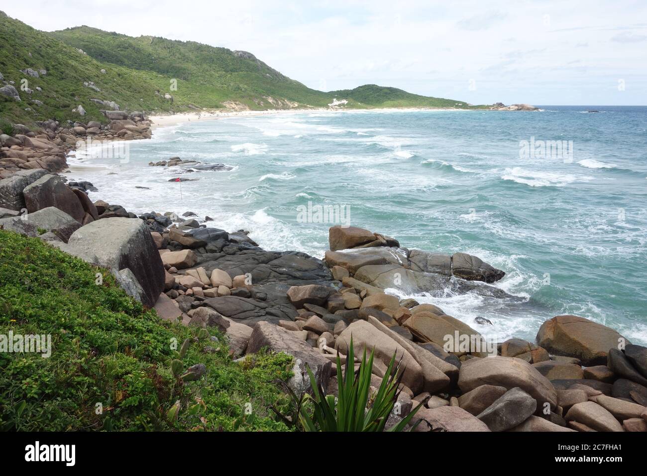 Scenery of ocean waves splashing to the shore in Mole beach, Brazil ...