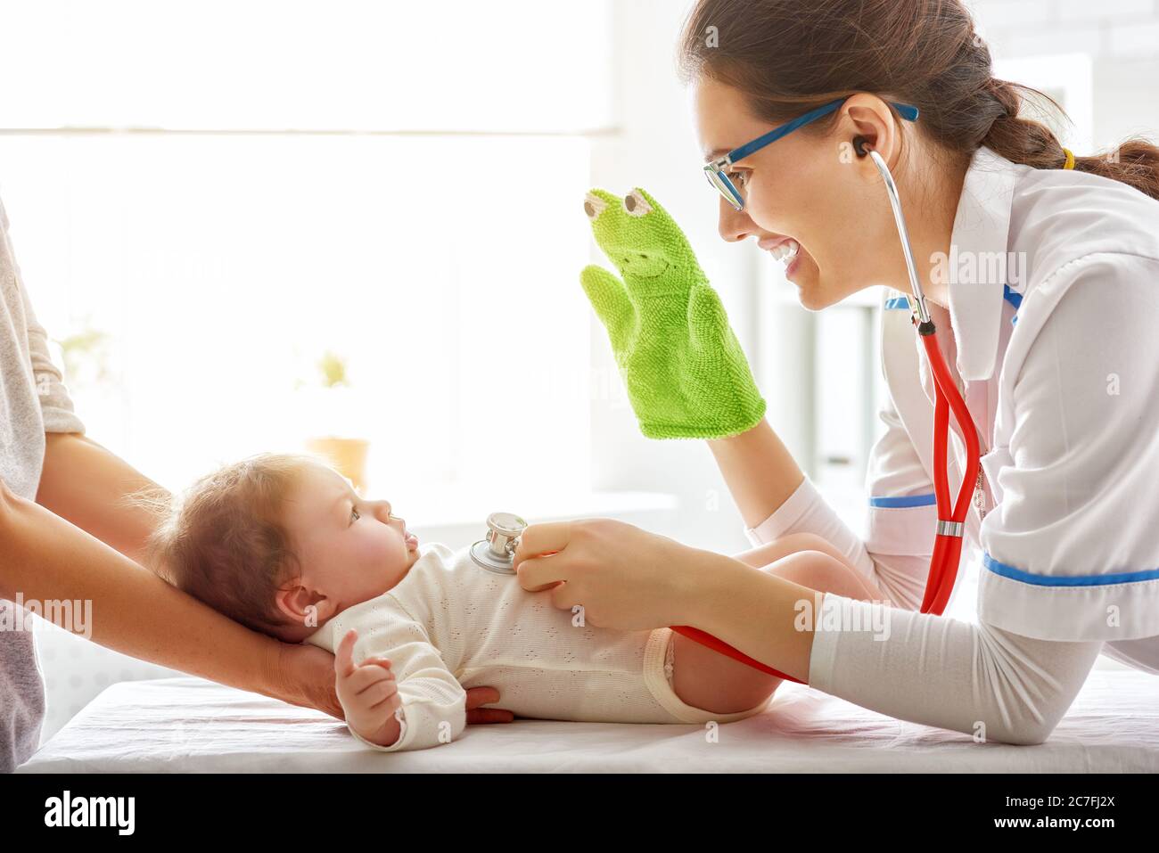 doctor examining a baby in a hospital Stock Photo - Alamy