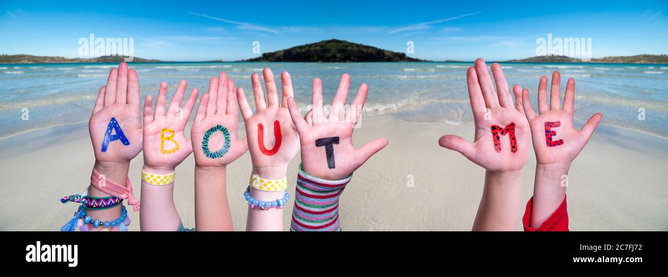 Children Hands Building Word About Me, Ocean Background Stock Photo - Alamy