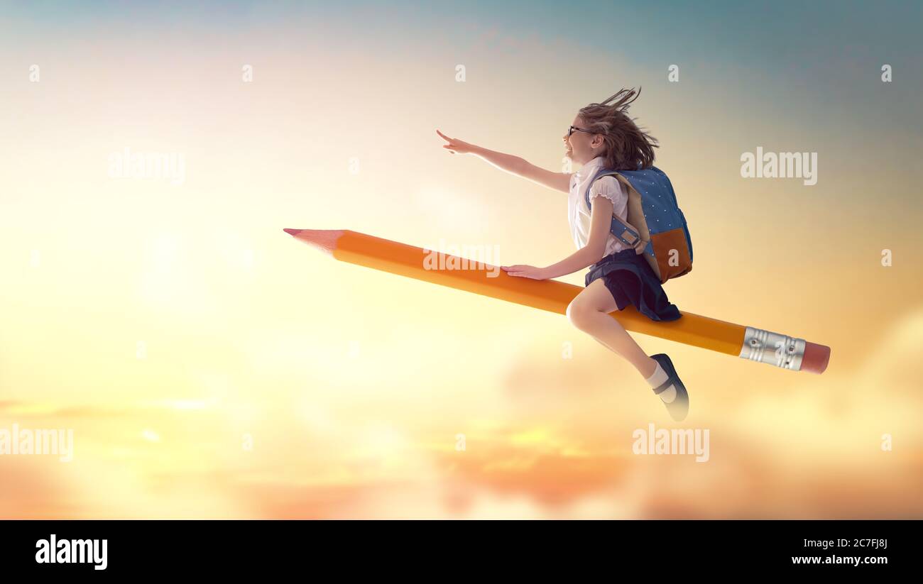 Back to school! Happy cute industrious child flying on the pencil on ...