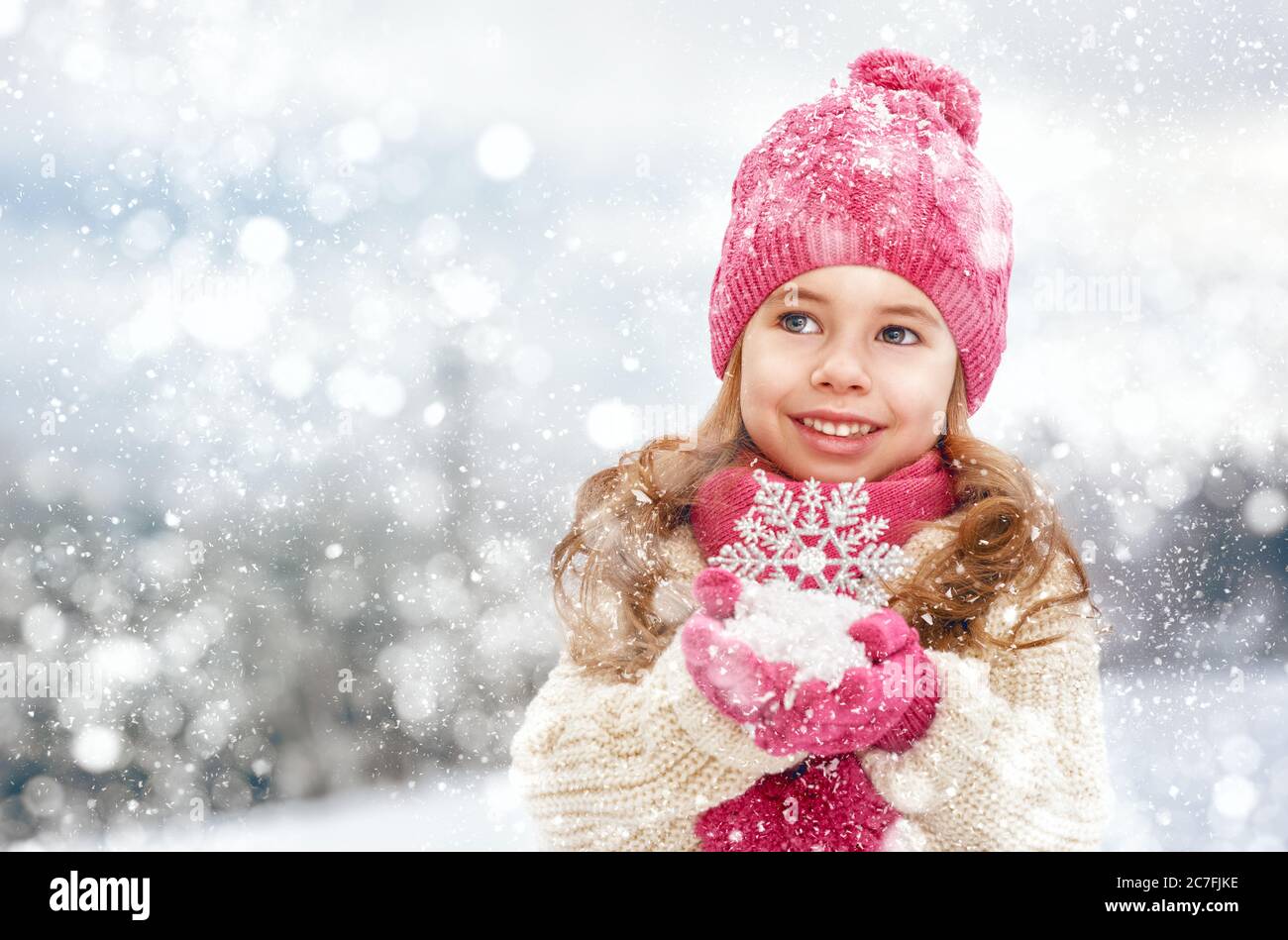 happy child girl plaing on a snowy winter walk Stock Photo - Alamy