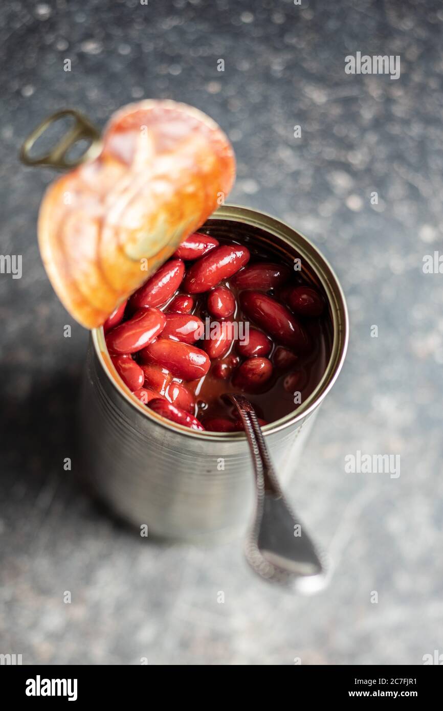 Canned red beans in tomato sauce in tin can on kitchen table Stock ...