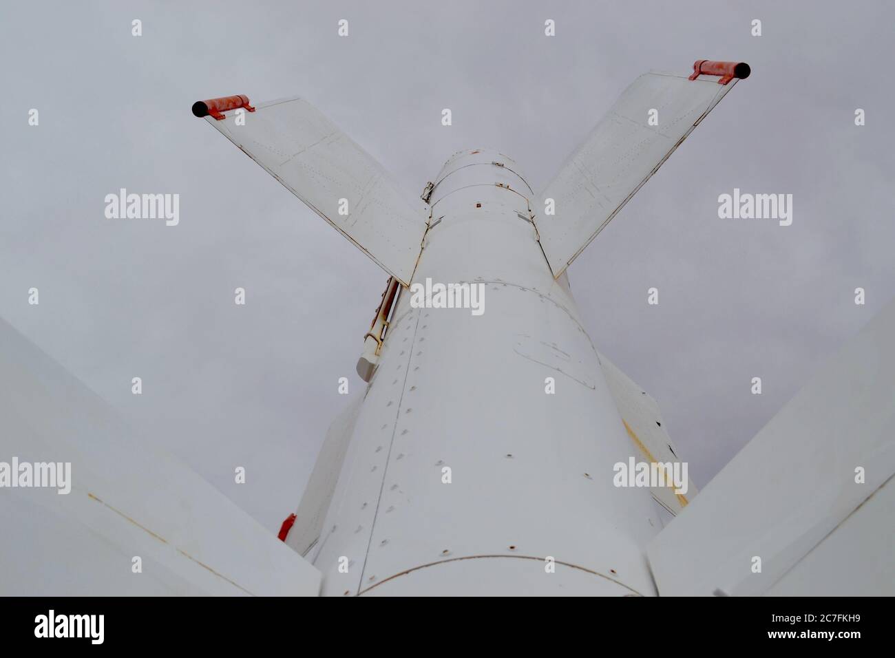 White and red tail section of a missile rocket at the space and missile ...