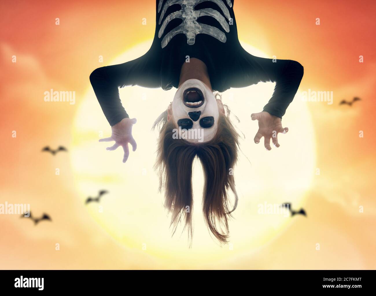 Happy Halloween! Cute little skeleton. Beautiful young child girl in ...