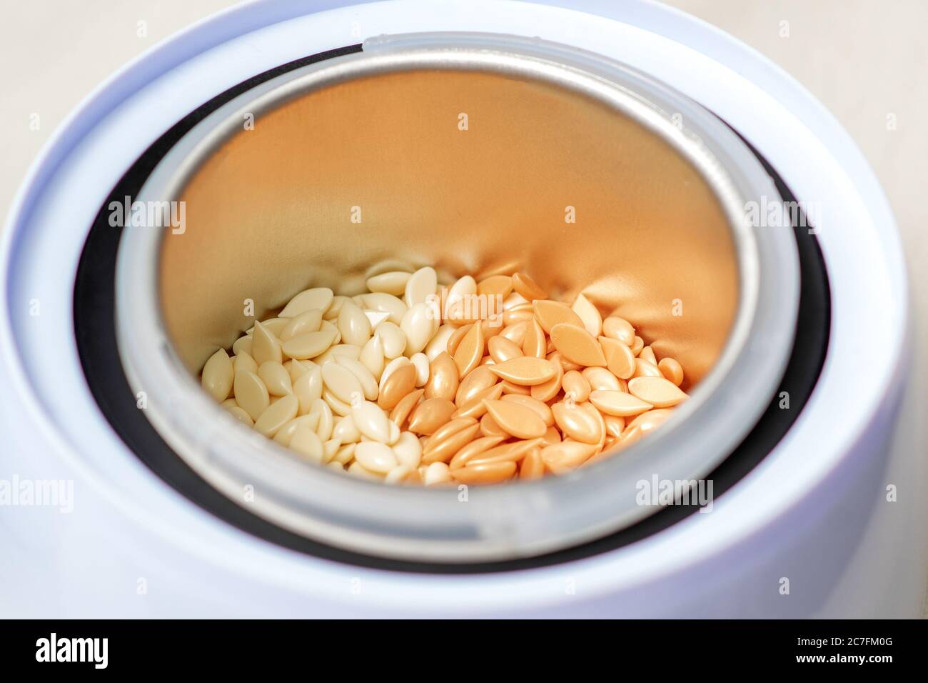 Wax depilation heating hi-res stock photography and images - Alamy