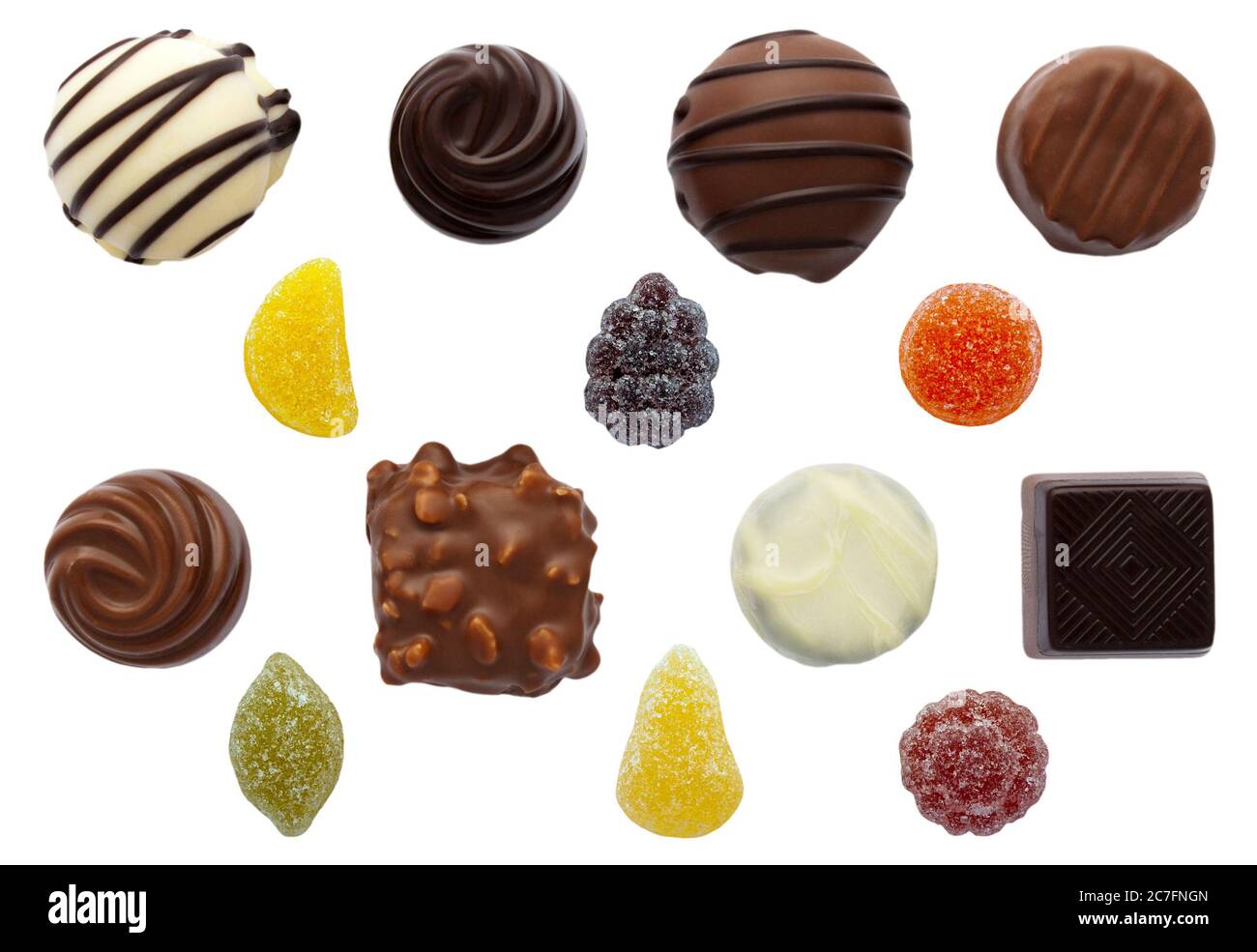 Mixed sweets with chocolates and fruit pastilles on an isolated white ...