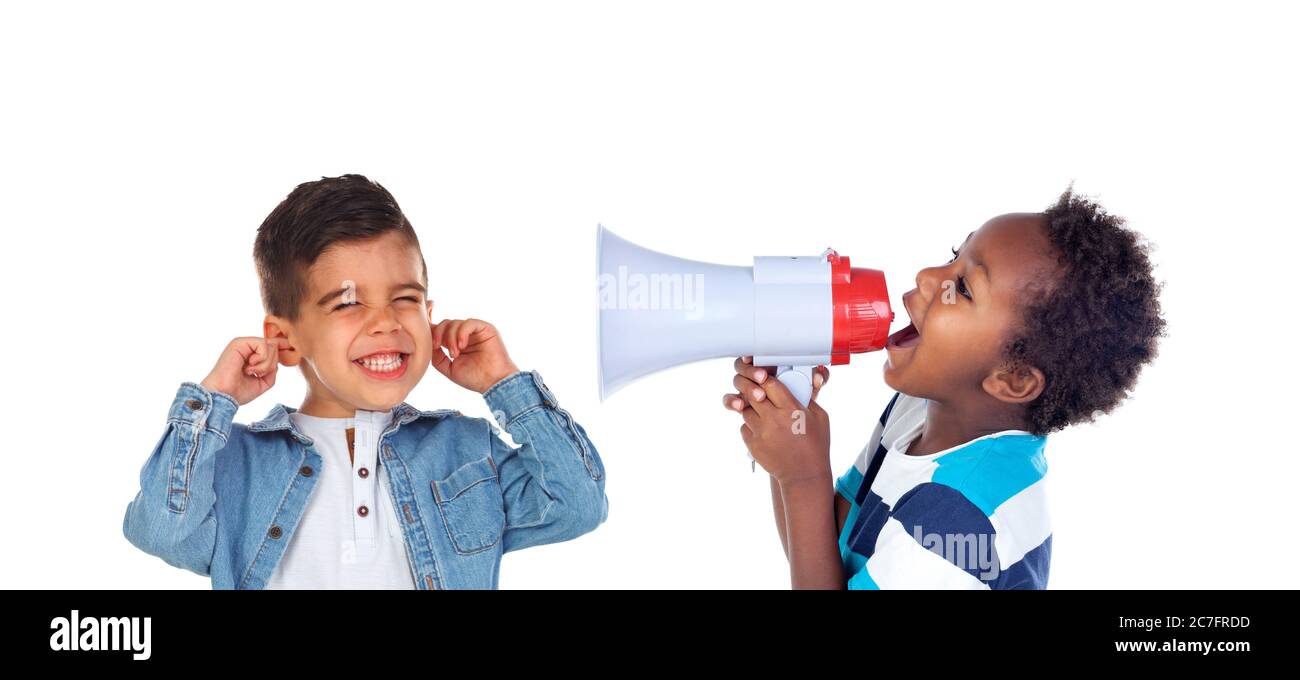 Funny children playing with a megaphone isolated on a white background ...