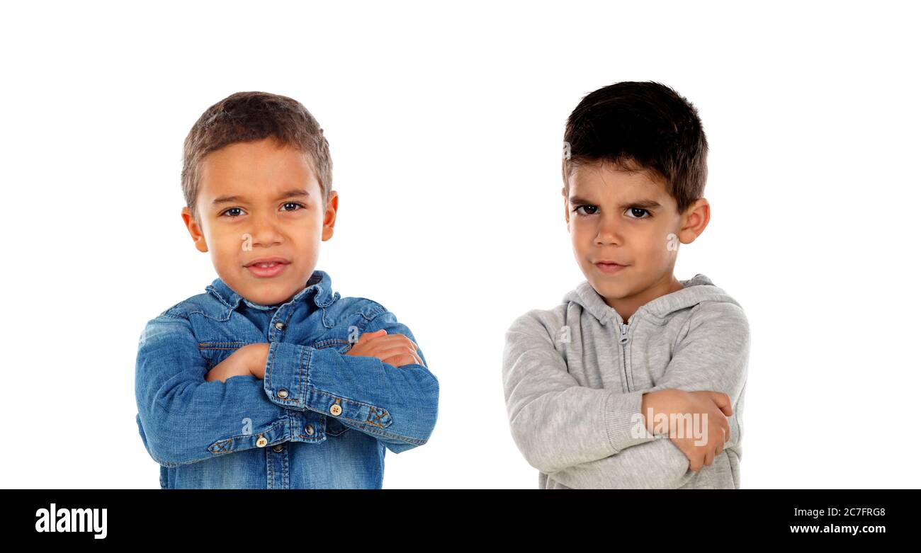 Two angry latin children isolated on a white background Stock Photo - Alamy