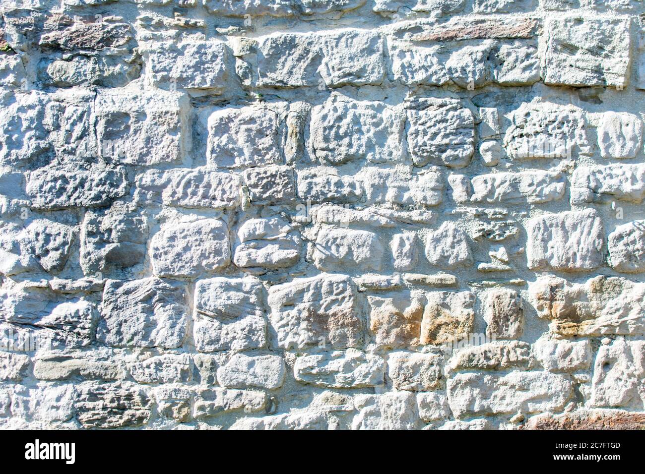 White stone wall under sunlight - a cool picture for backgrounds and ...