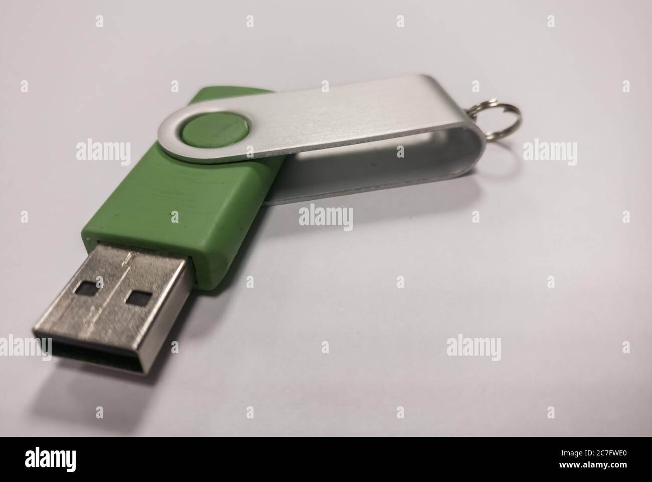 Green USB flash drive on a white background Stock Photo - Alamy