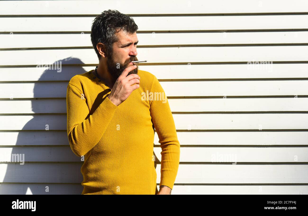 Bad habit and unhealthy lifestyle concept. Man with serious face on ...