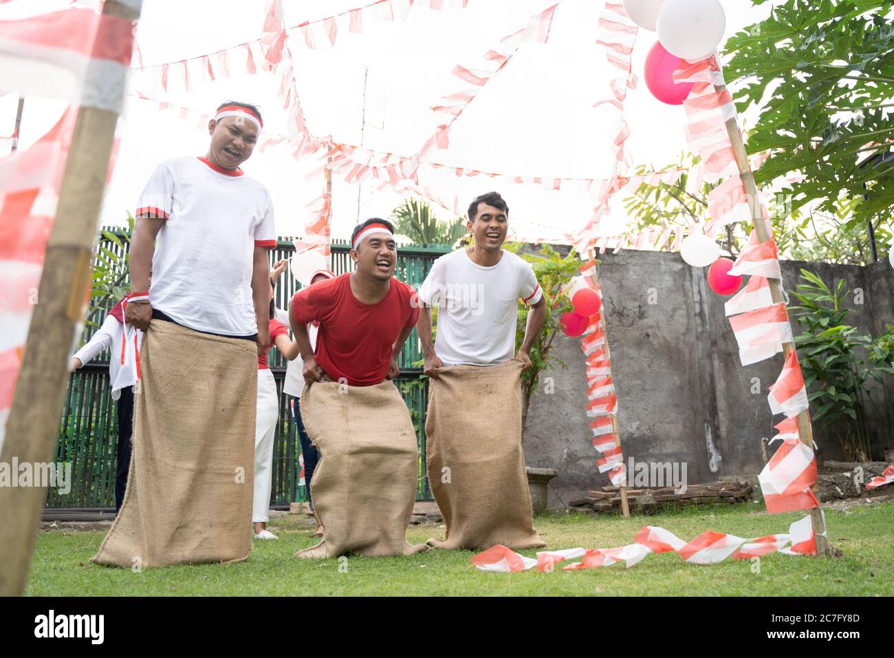 Sack race participants jumped each other by jumping to quickly reach ...