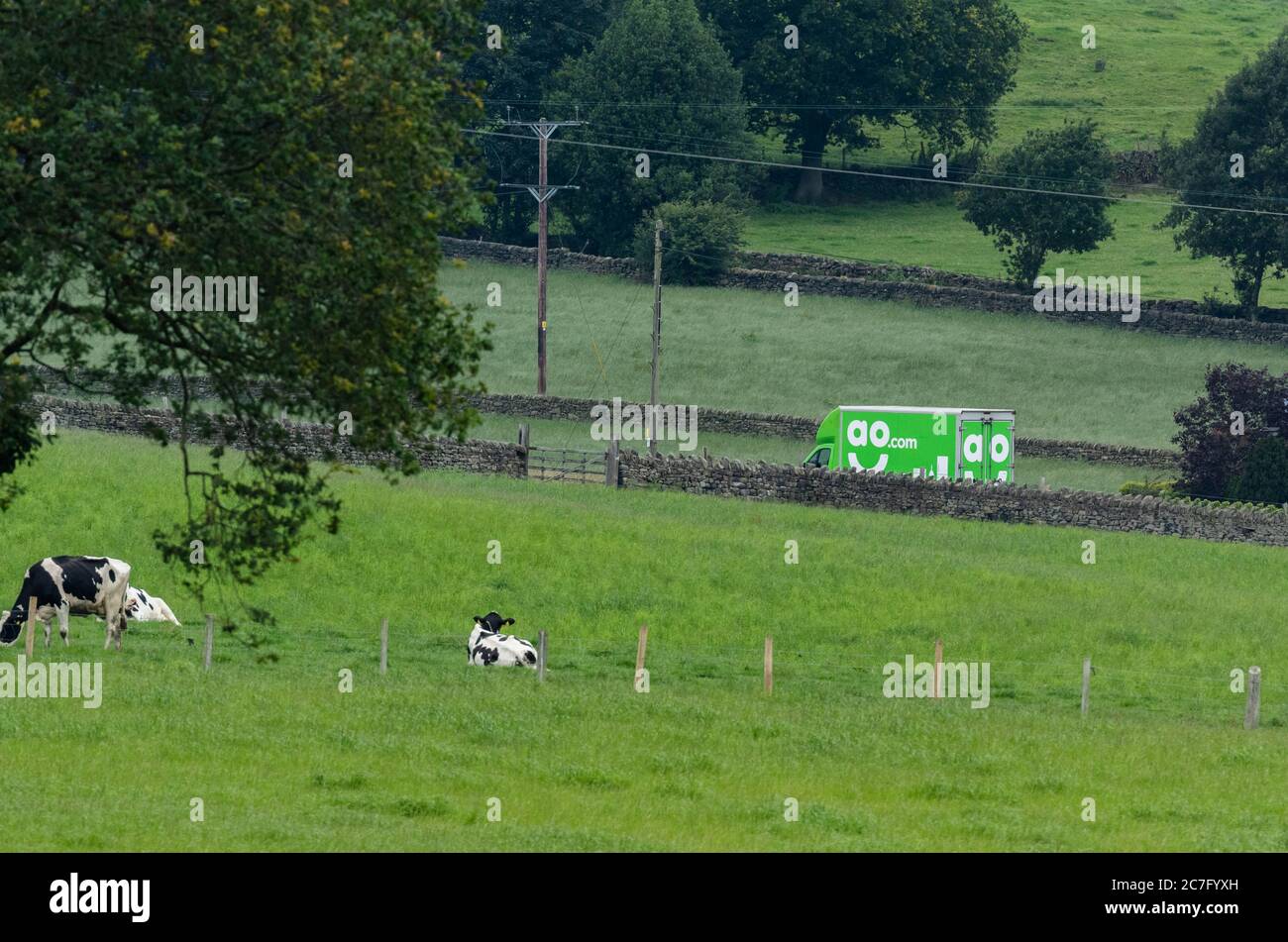 An ao delivery van driving along a country road in Baildon, Yorkshire ...