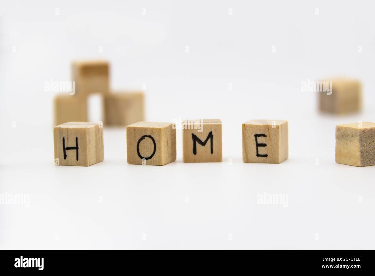 A word Home written on the wood cubes. Home lettering made of wooden ...