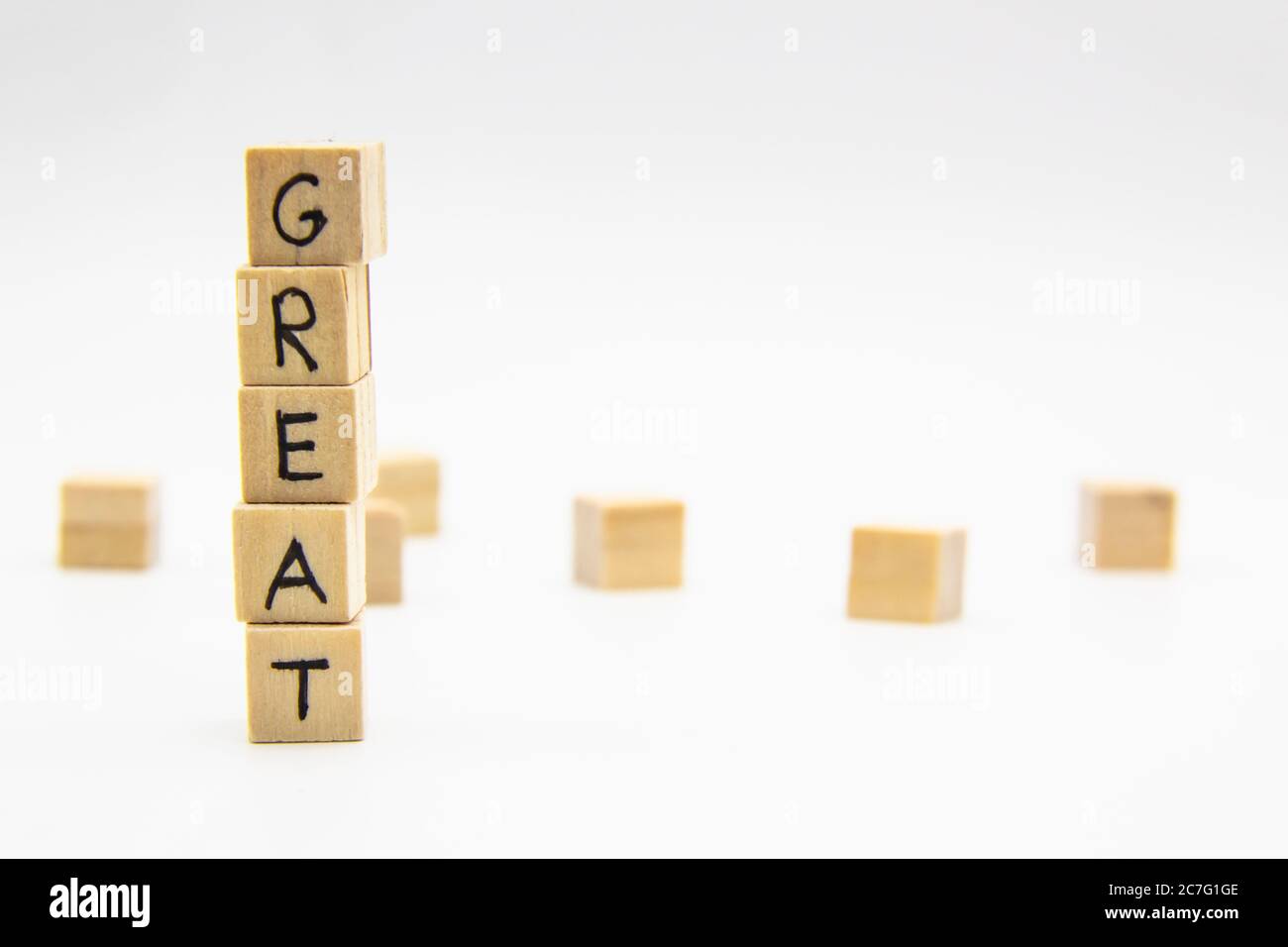 A word Great written on the wood cubes. Great lettering made of wooden ...