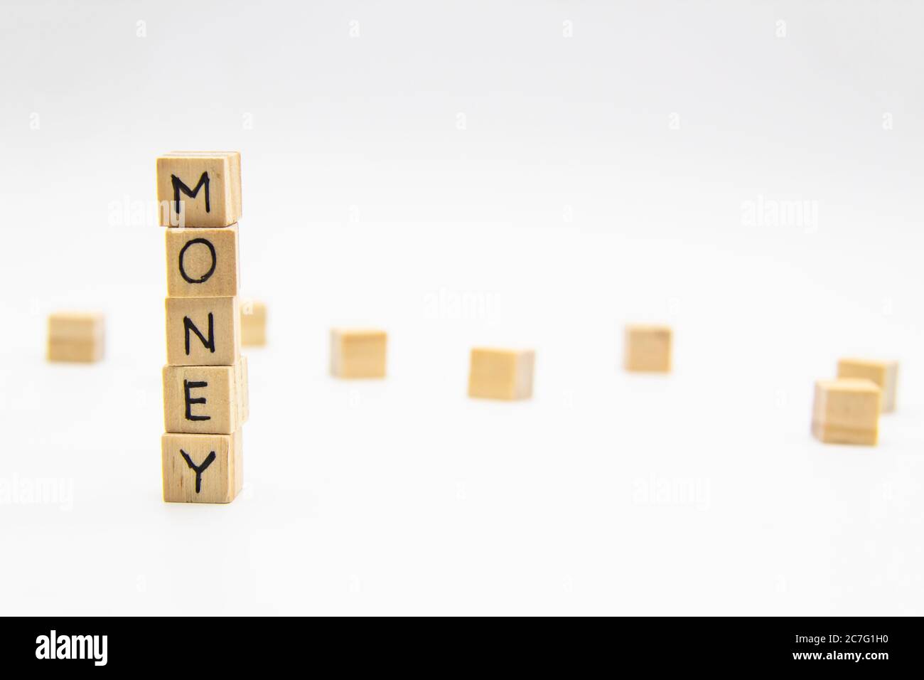 A word Money written on the wood cubes. Money lettering made of wooden ...