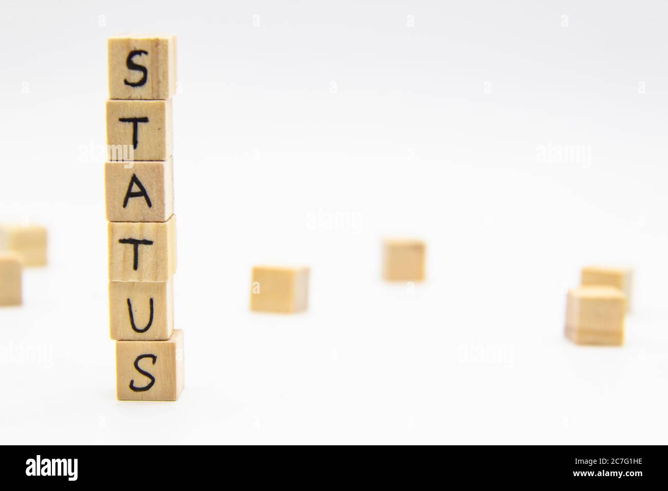 A word Status written on the wood cubes. Status lettering made of ...