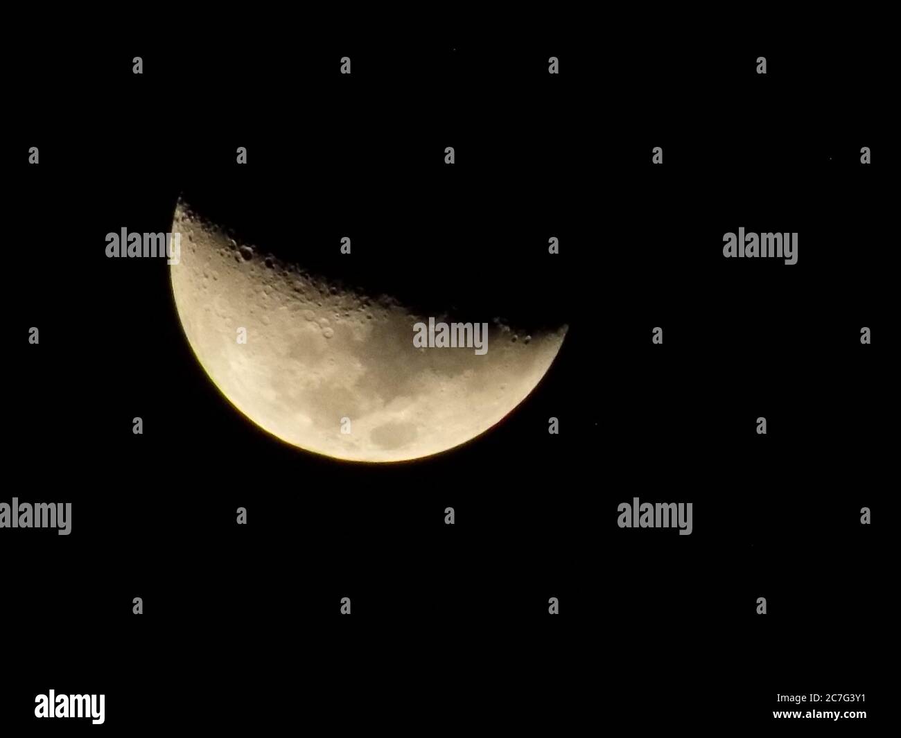 Bright half-moon with a black background - perfect for a wallpaper ...