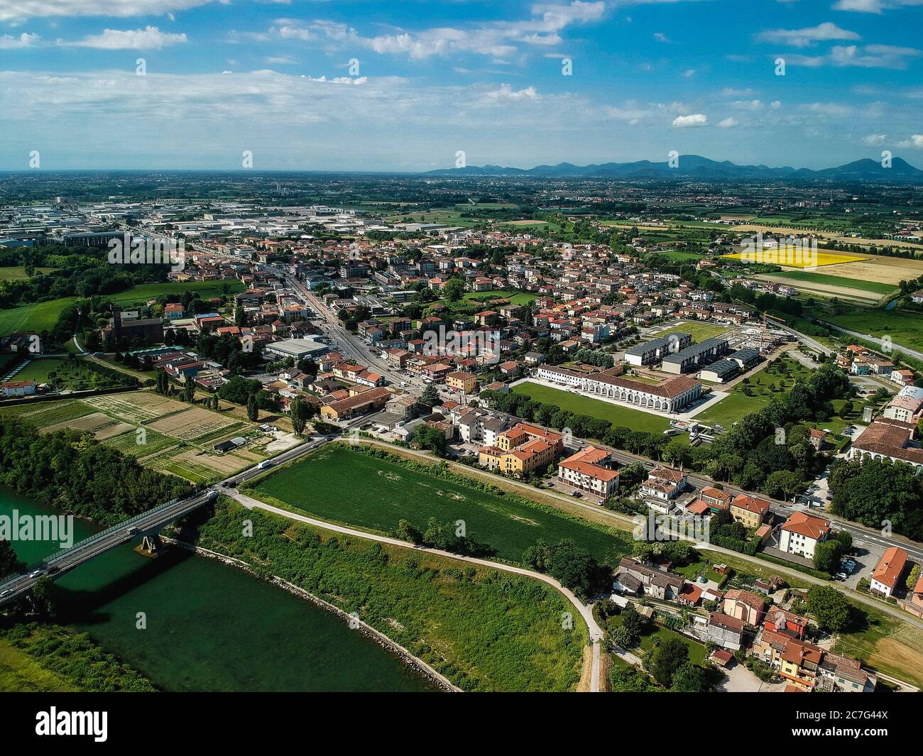 Italy, Veneto region, aerial view of Brenta river and Limena village ...