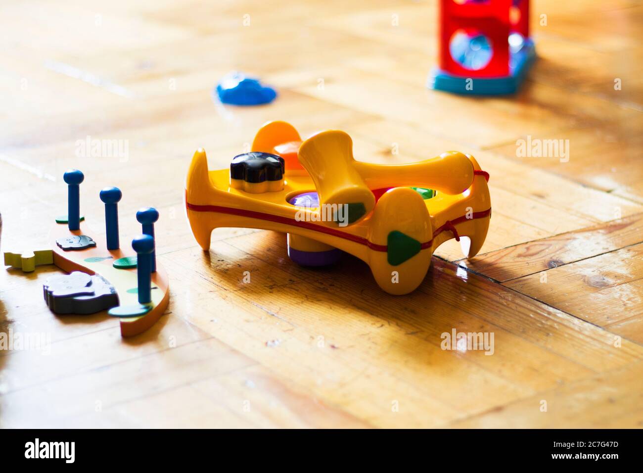 Toys for children on the floor Stock Photo - Alamy