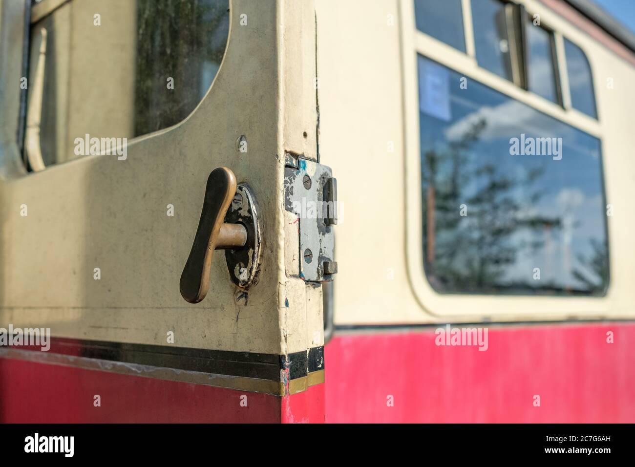 Close-up view of the old slam-door passenger train door handle, seen in ...