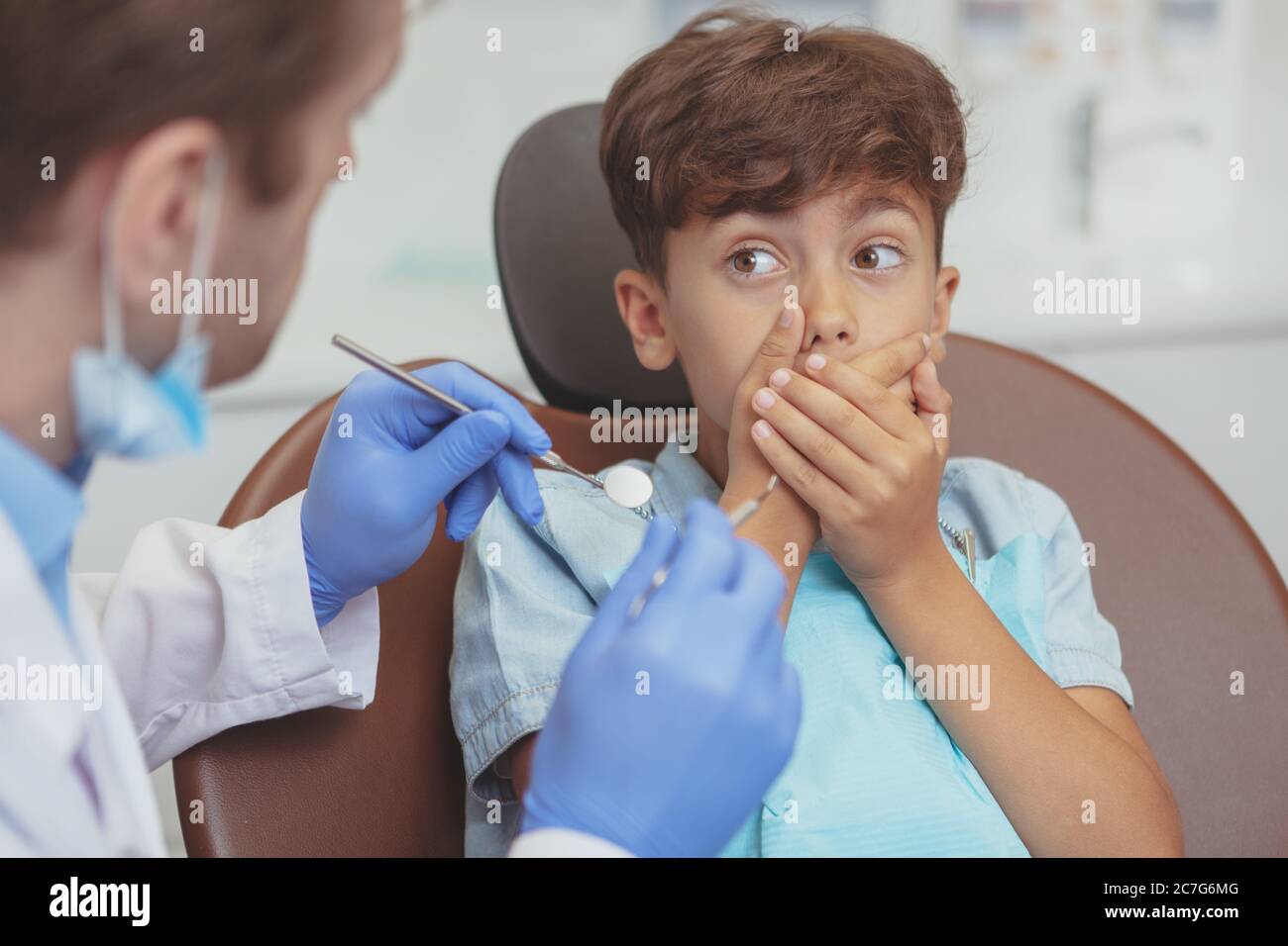 Scared child, dentistry, toothache concept. Cropped close up of a young ...