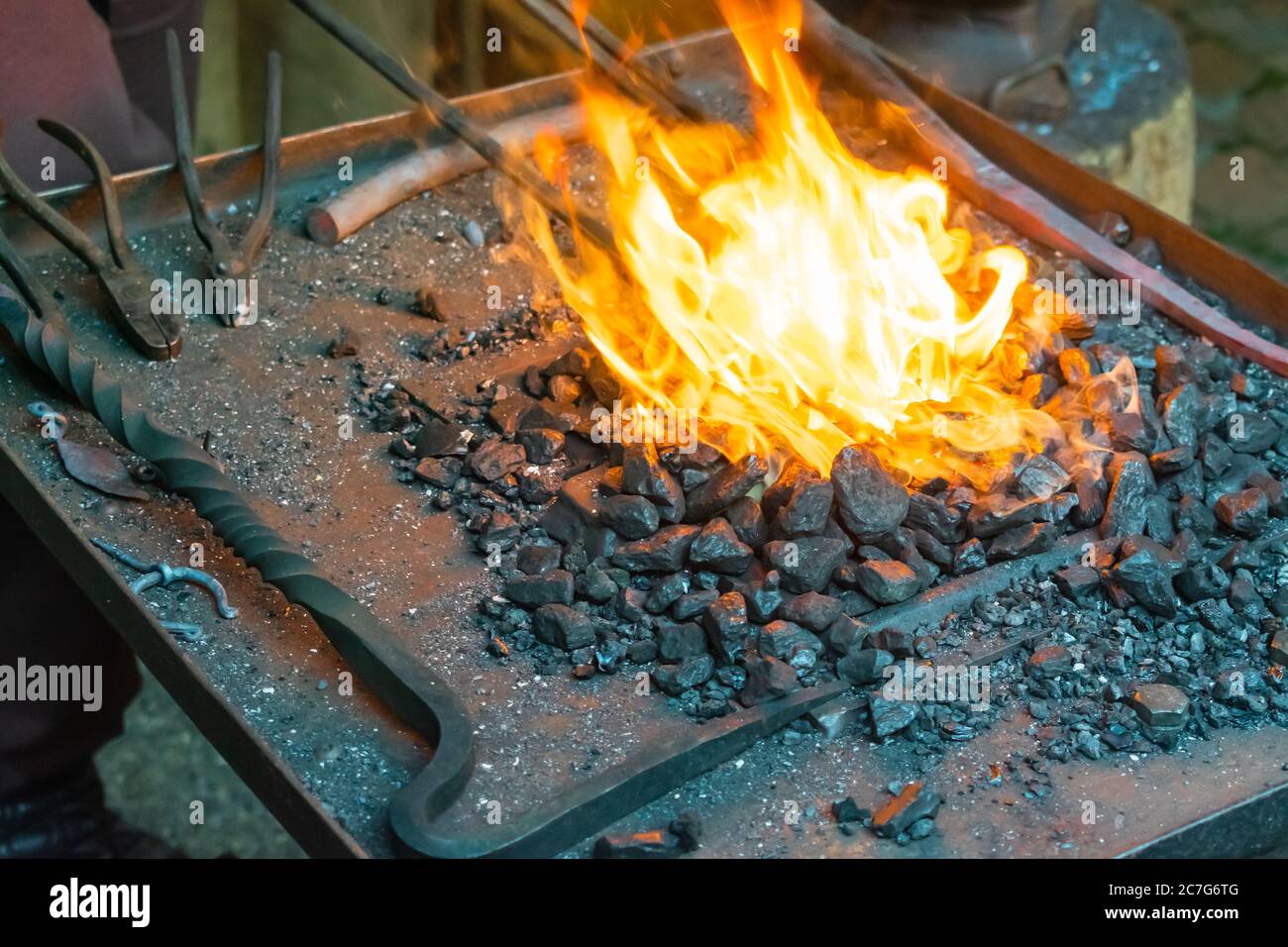 High angle shot of burning coal in the blacksmith's workshop with a big ...