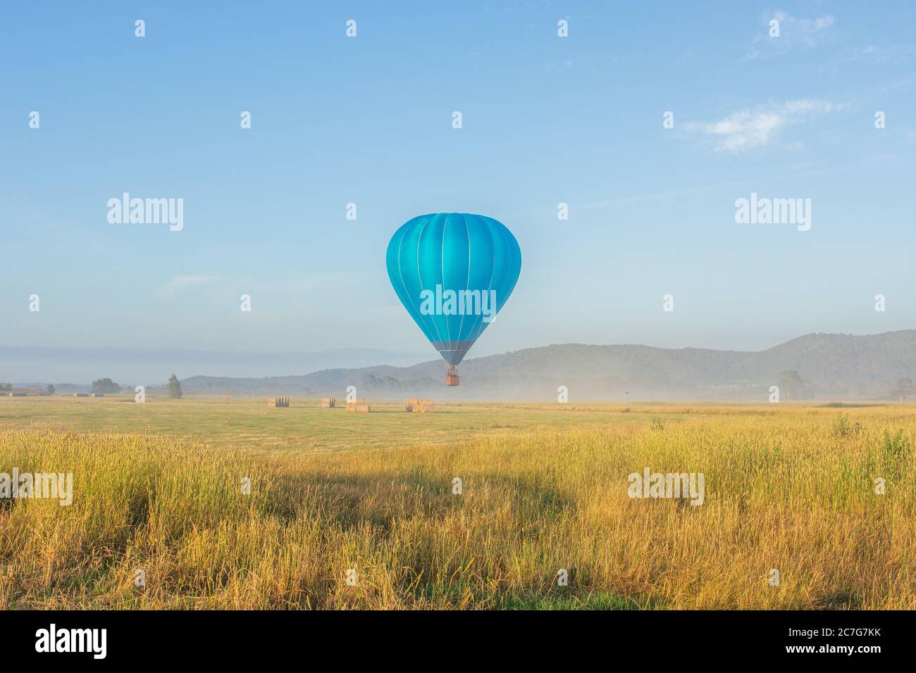 Blue air balloon flying in the air during daytime Stock Photo - Alamy