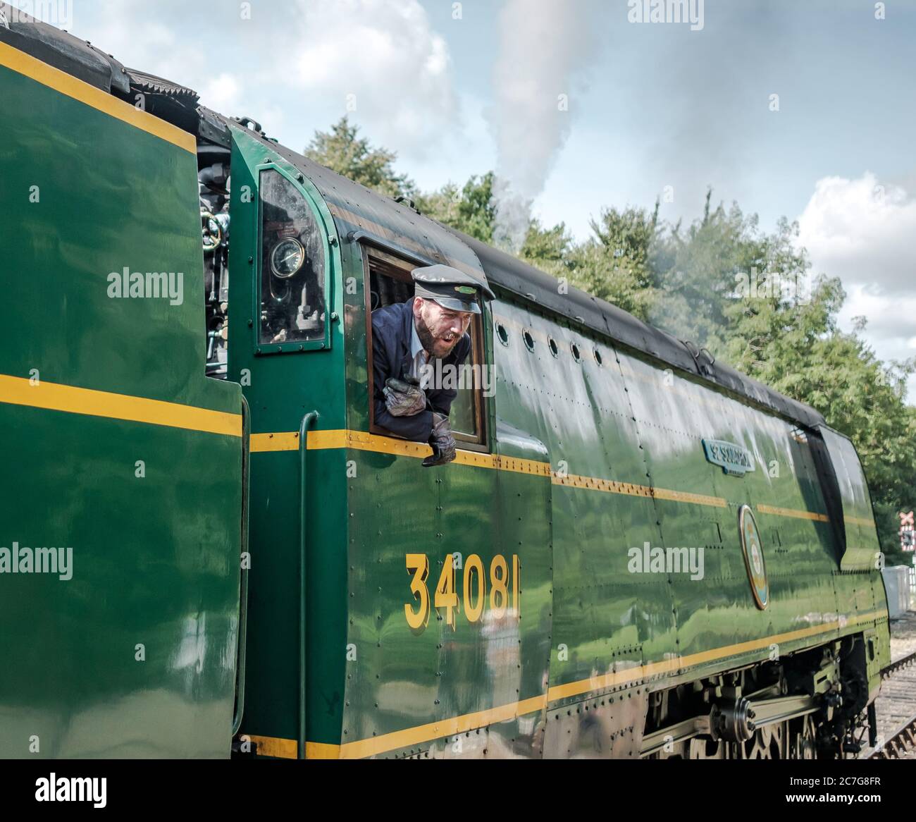 View of a restored, vintage British steam locomotive complete with the ...