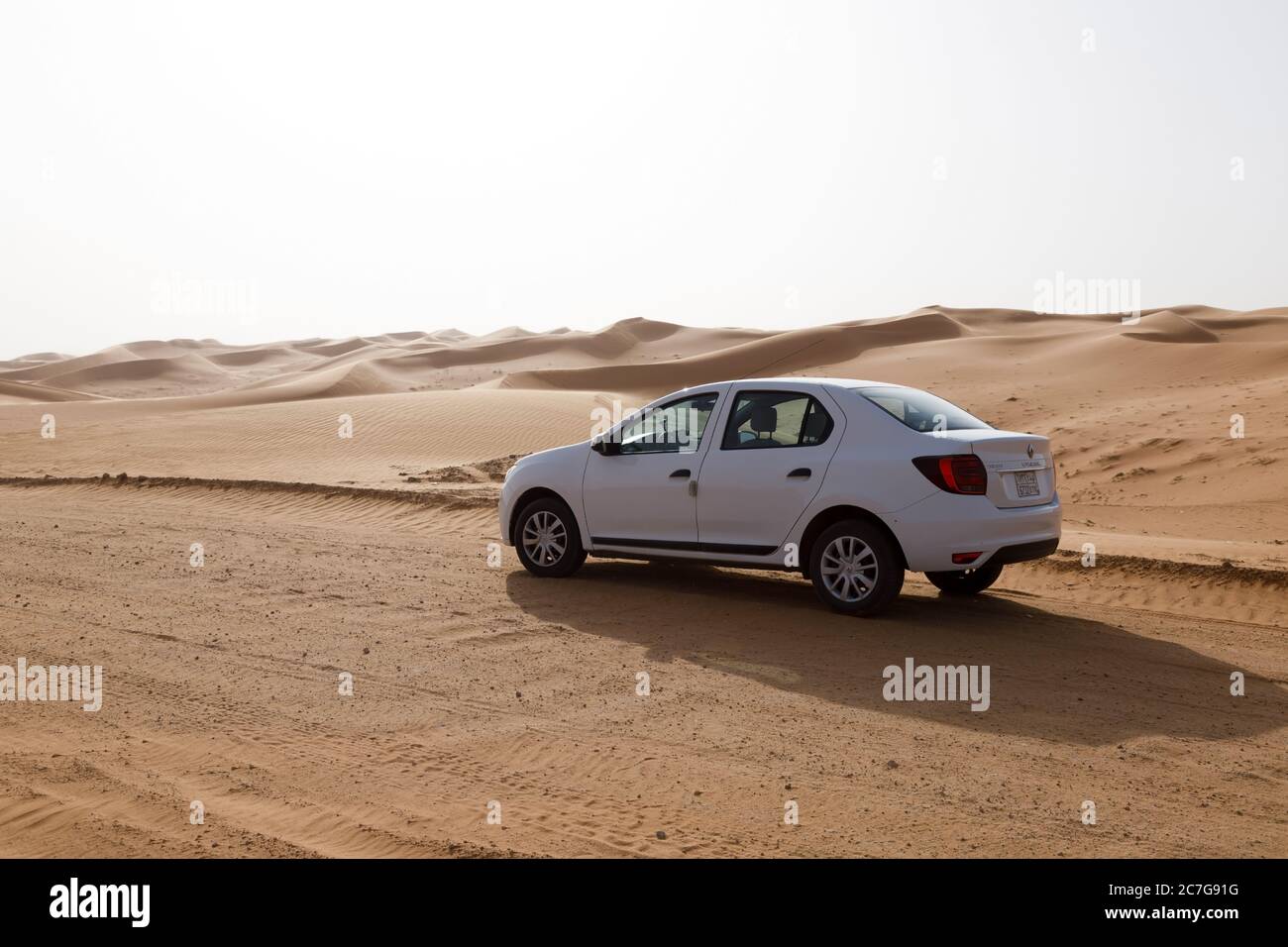 Riad, Saudi Arabia, February 16 2020: Typical gravel road with a white ...