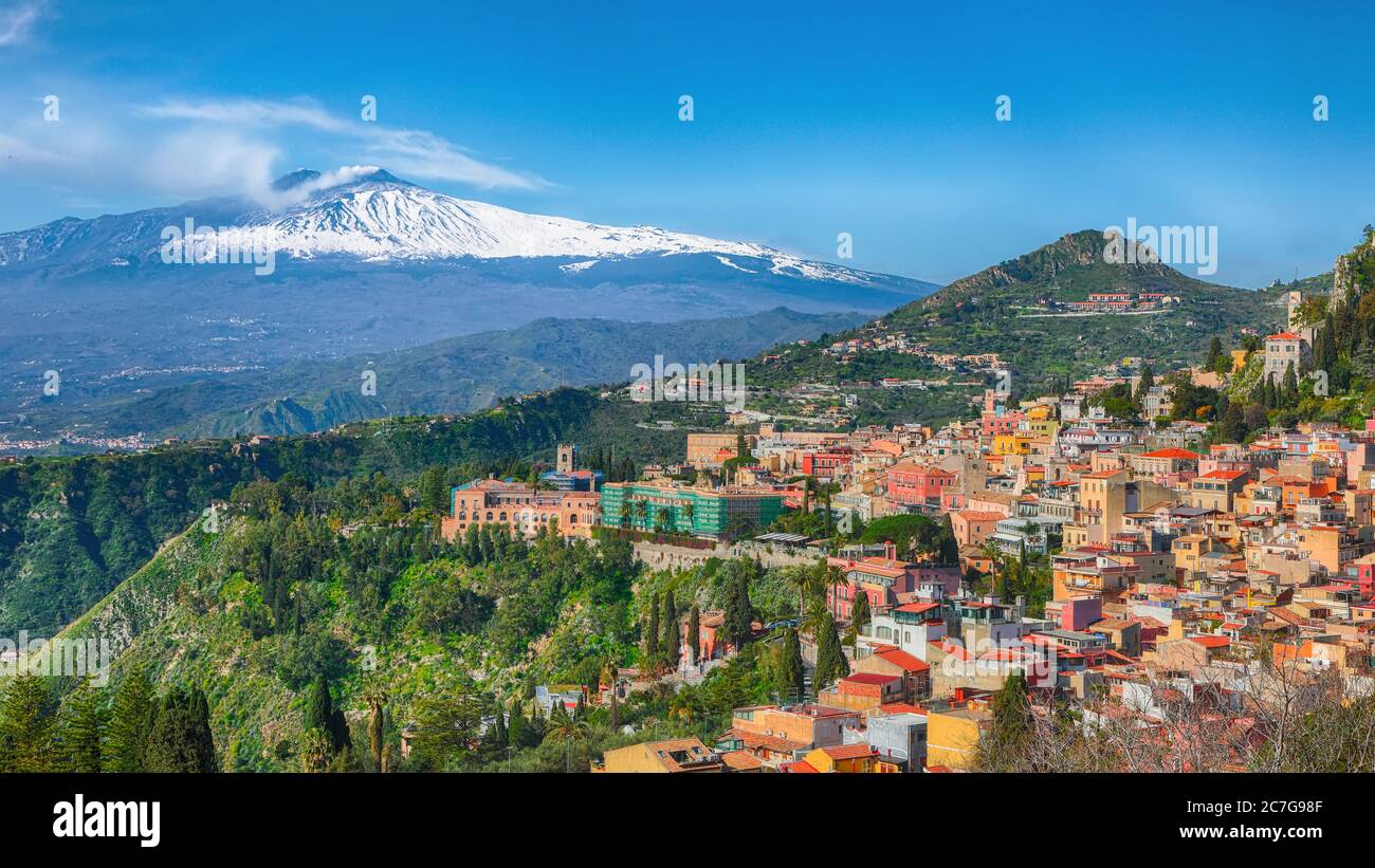 Etna volcano and Taormina town aerial panoramic view. Roofs of a lot of ...