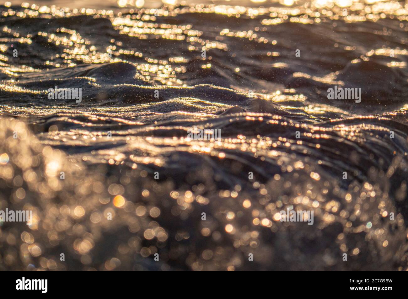 sea wave closeup macro at sunset time Stock Photo - Alamy