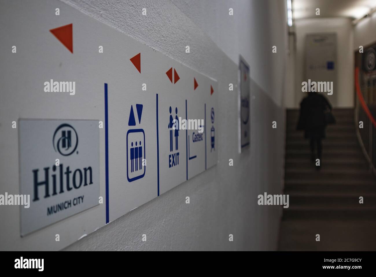 MUNICH, GERMANY - Dec 20, 2019: Hilton and elevator signs with women ...
