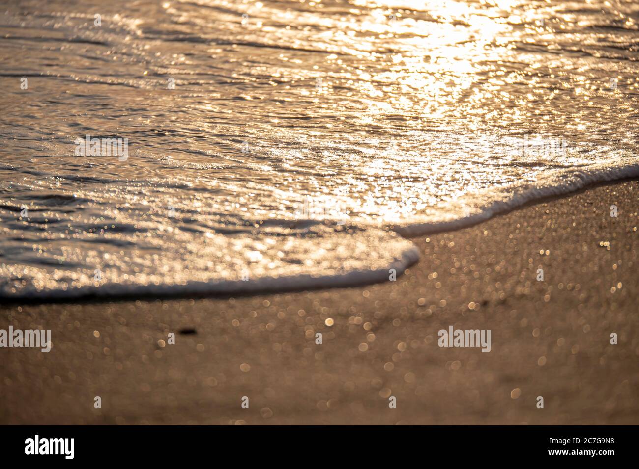 wave splash sea beach close up macro sunrise Stock Photo - Alamy