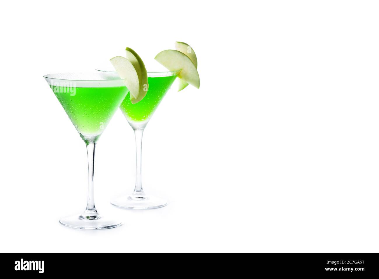 Green appletini cocktail in glass isolated on white background. Copy ...
