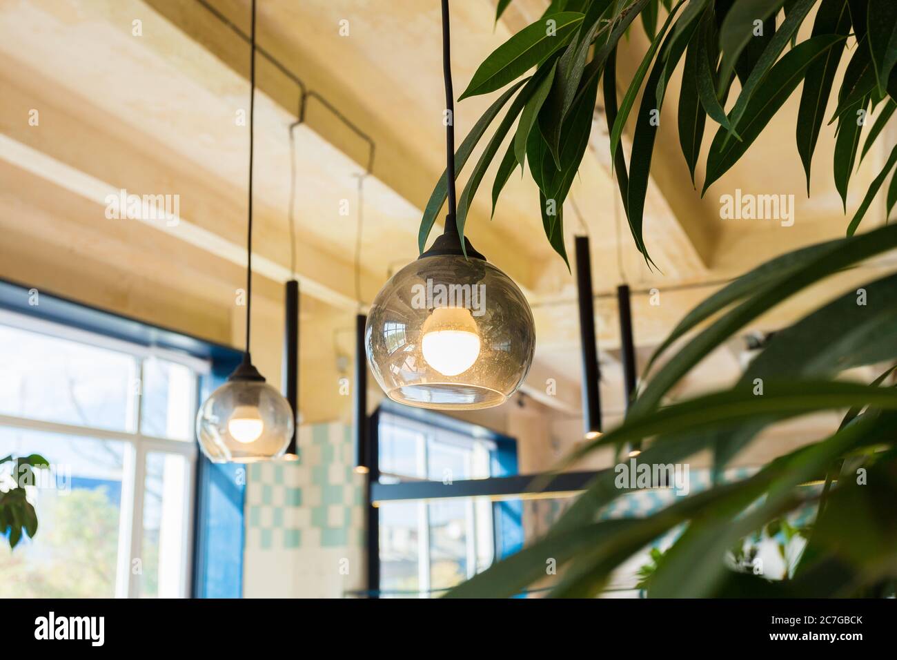 modern glass and metal loft lamps in a design office Stock Photo - Alamy